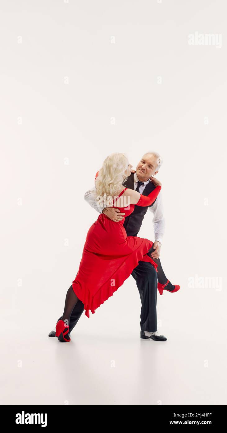 Full-length image of senior couple, man and woman dressed in elegant ...