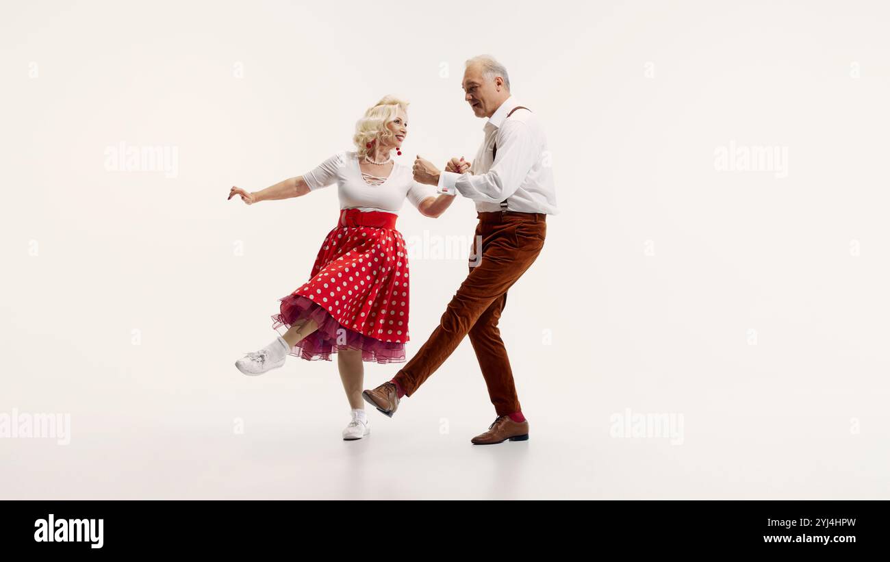 Dynamic image of elderly couple performing lindy hop dance classic ...