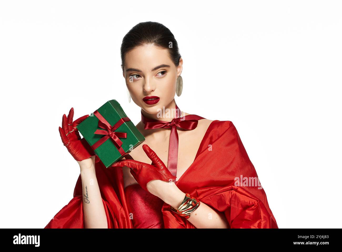 The elegant woman captures attention with her striking outfit while ...