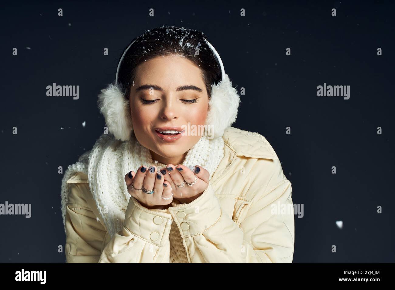 Beautiful woman catches snowflakes hi-res stock photography and images ...