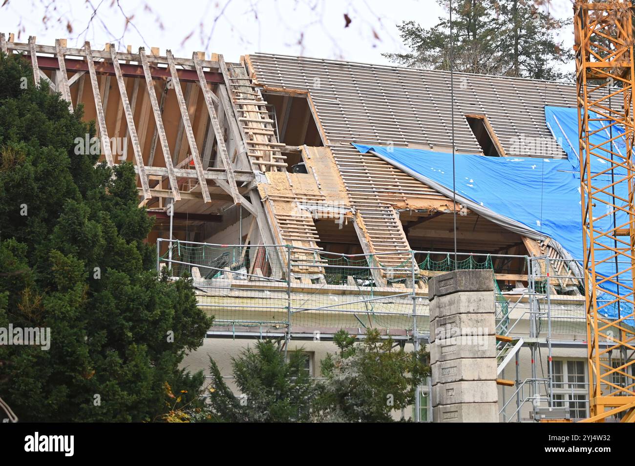 Roof renovation. An old house in need of renovation gets a new roof ...
