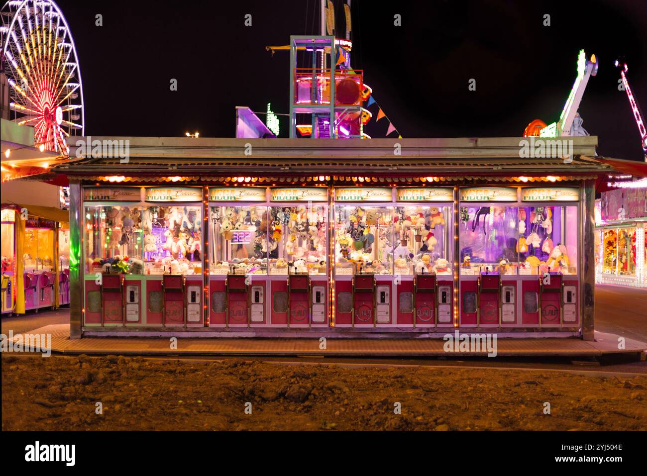 A Vibrant Nighttime Carnival Game Booth, filled with Colorful Prizes ...