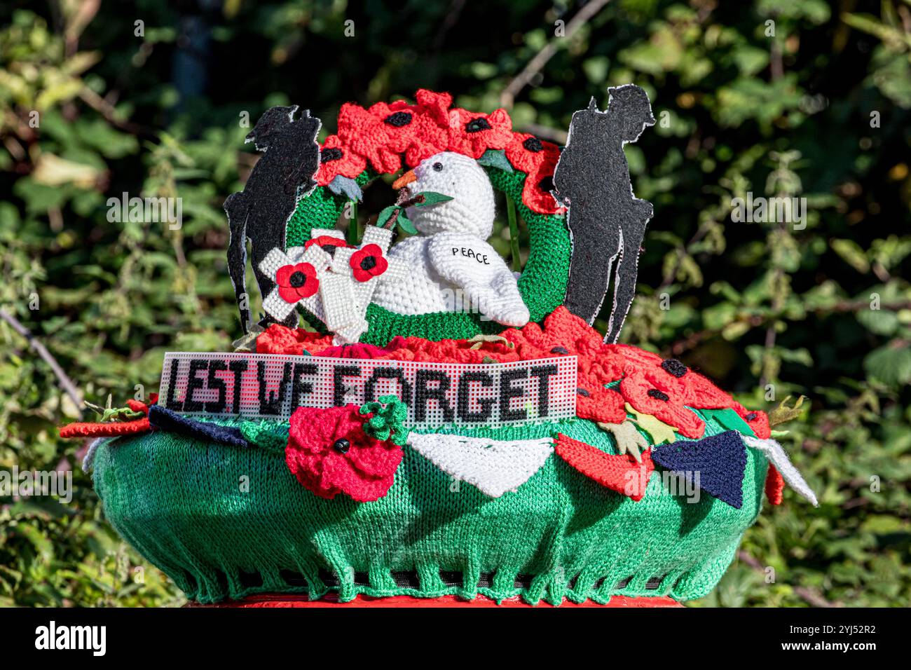 'Lest We Forget' remembrance post box topper on a traditional red Post ...