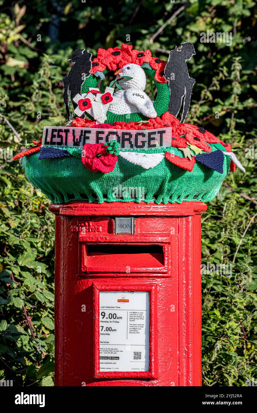 'Lest We Forget' remembrance post box topper on a traditional red Post ...