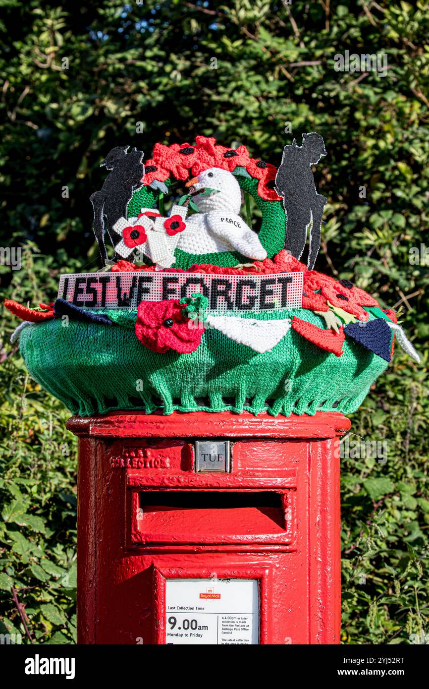 'Lest We Forget' remembrance post box topper on a traditional red Post ...