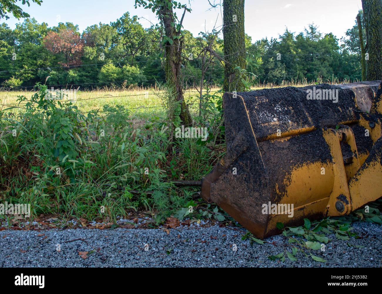Close up look at the back of a front end loader along the road after a ...