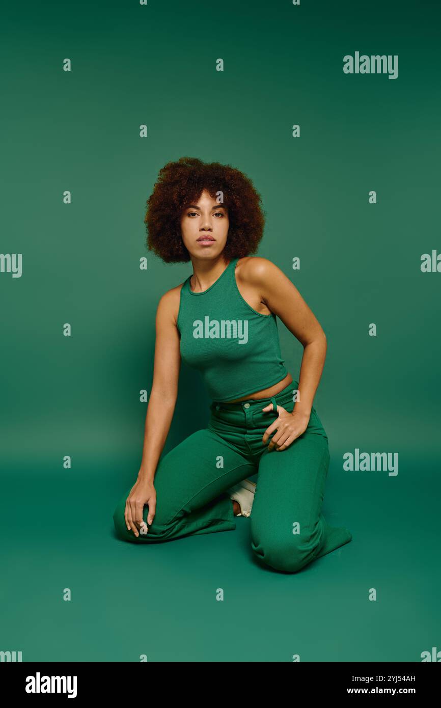 A pretty young African American woman showcases her style while ...
