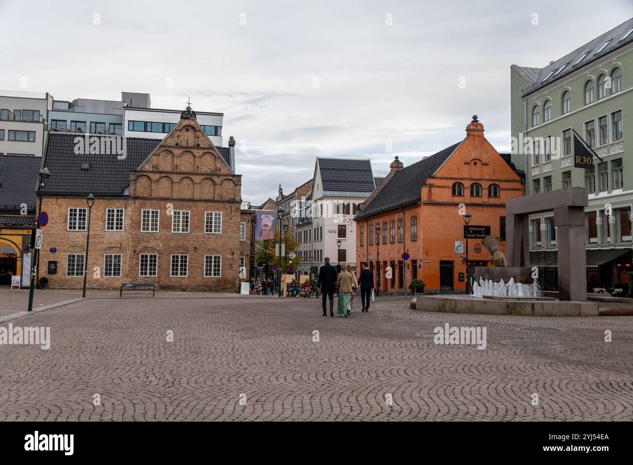 A water fountain with a gloved hand pointing to the foundation of Oslo ...