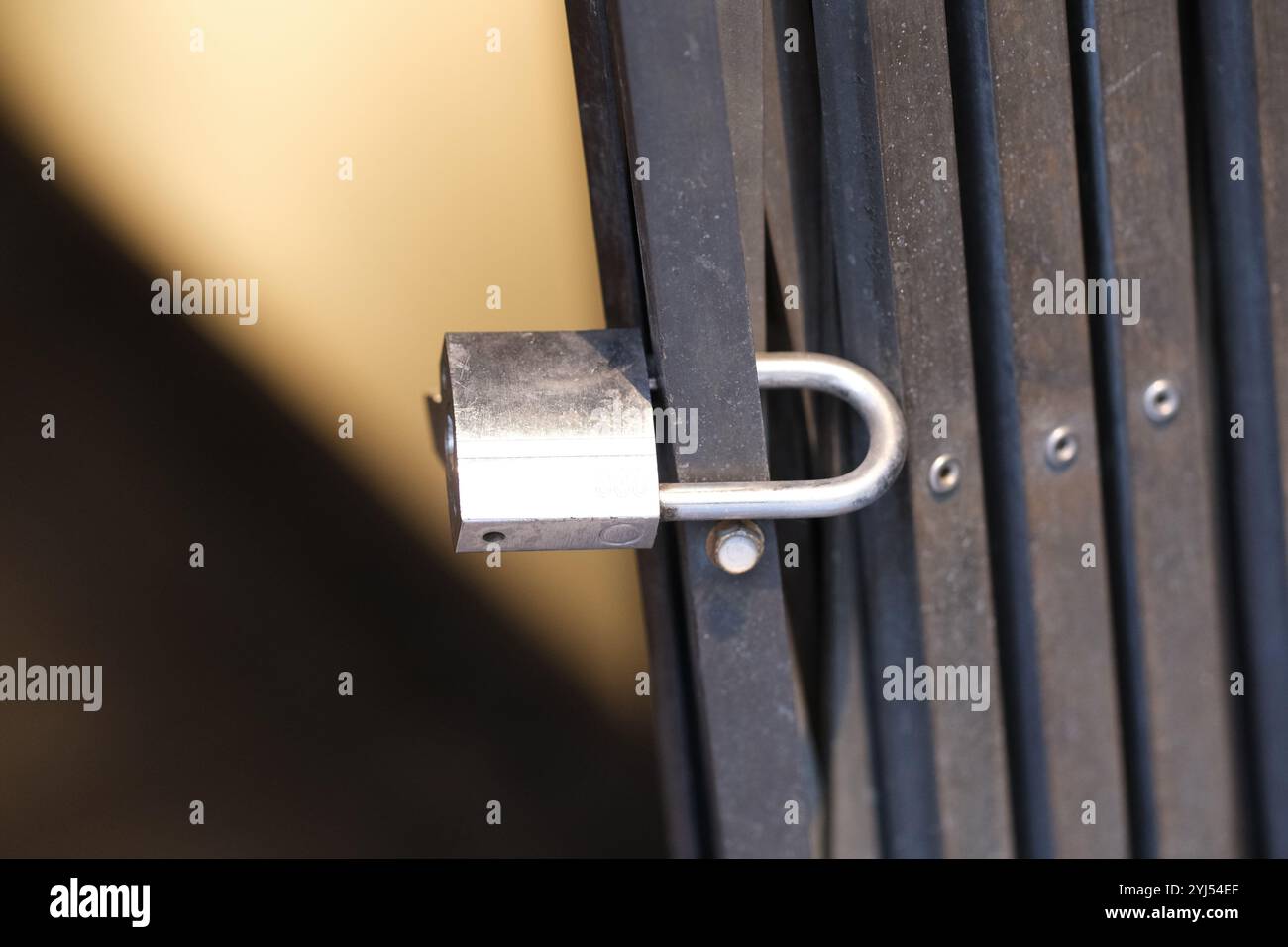 Metal lock on a folded steel door Stock Photo - Alamy