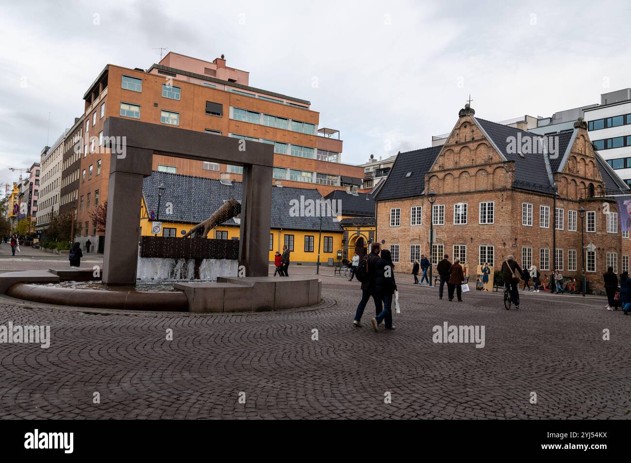 A water fountain with a gloved hand pointing to the foundation of Oslo ...