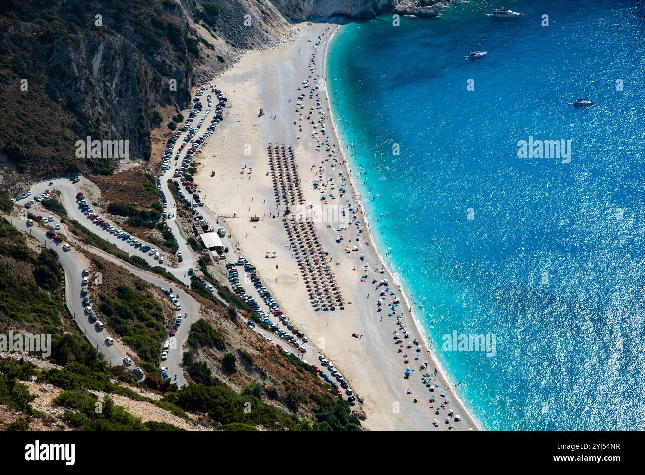 Tropical beach view with crystal clear water with tourist people on the ...