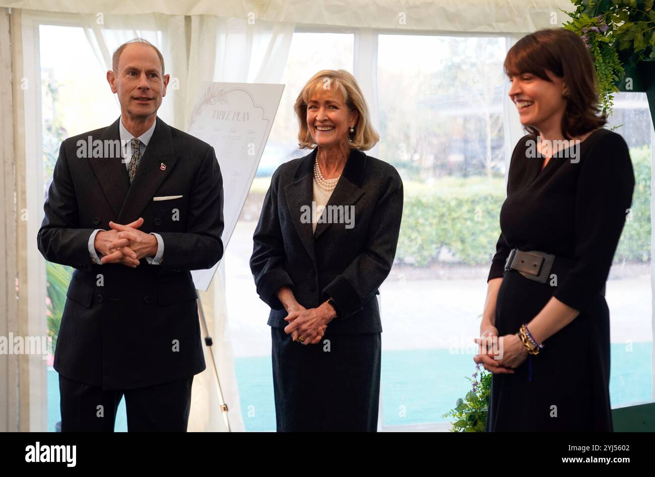 The Duke of Edinburgh (left) is welcomed by Penelope Knatchbull ...