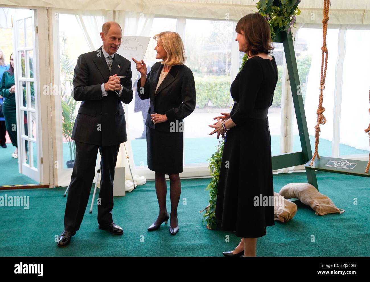 The Duke of Edinburgh (left) is welcomed by Penelope Knatchbull ...