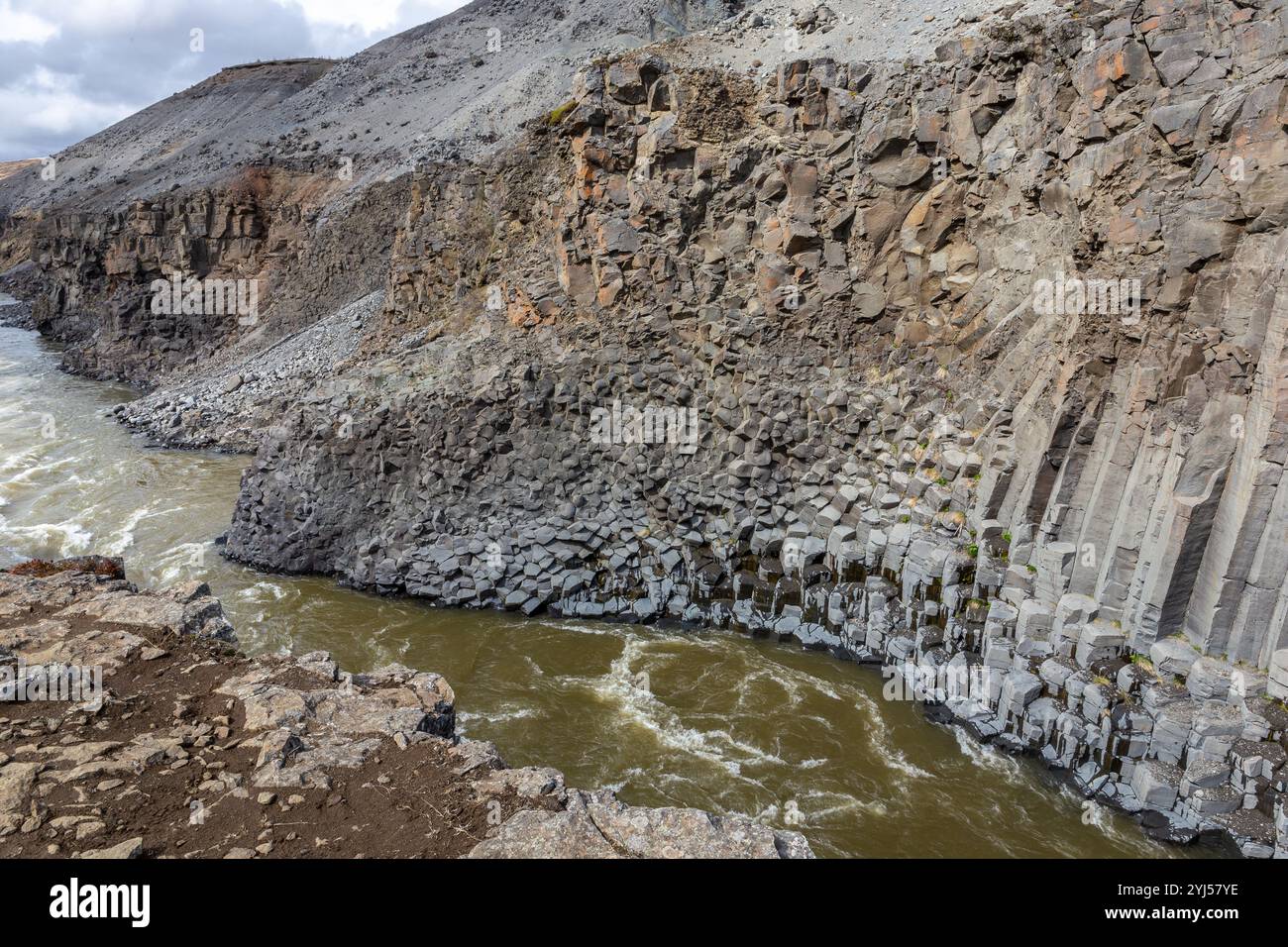 Studlagil Canyon (The Basalt Canyon) view of the ravine with brown ...