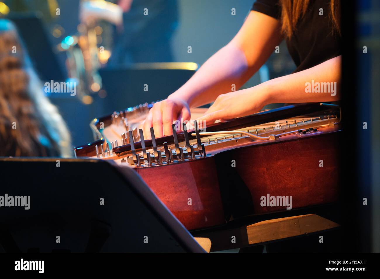 Playing the traditional Finnish instrument kantele Stock Photo - Alamy