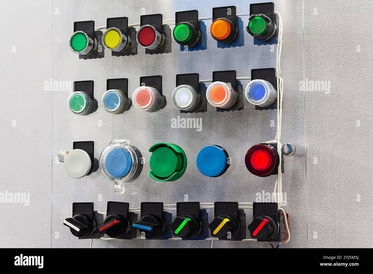 Various electrical button switches on an exhibition stand. Energy ...