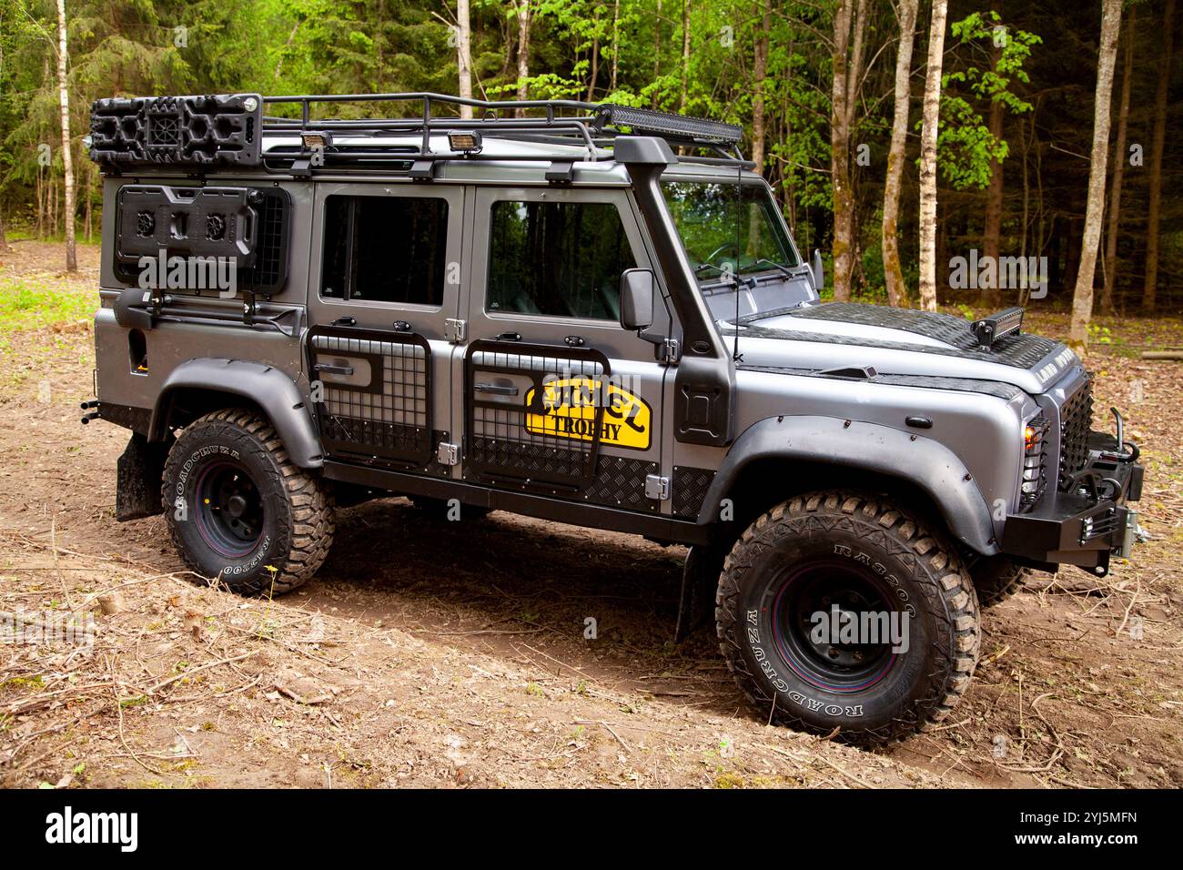Equipped Land Rover Defender is ready for aff road in the forest with ...