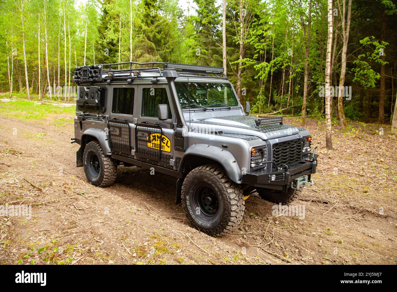 Equipped Land Rover Defender is ready for aff road in the forest with ...