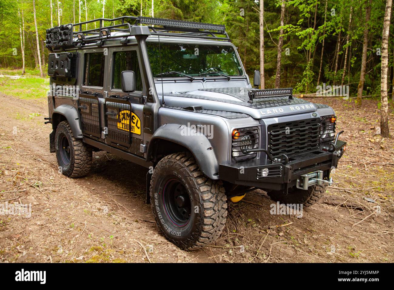Equipped Land Rover Defender is ready for aff road in the forest with ...