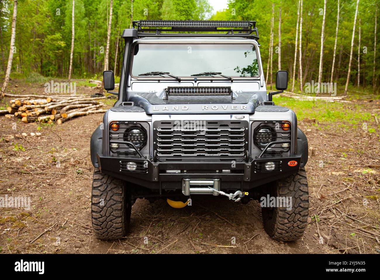 Equipped Land Rover Defender is ready for aff road in the forest with ...