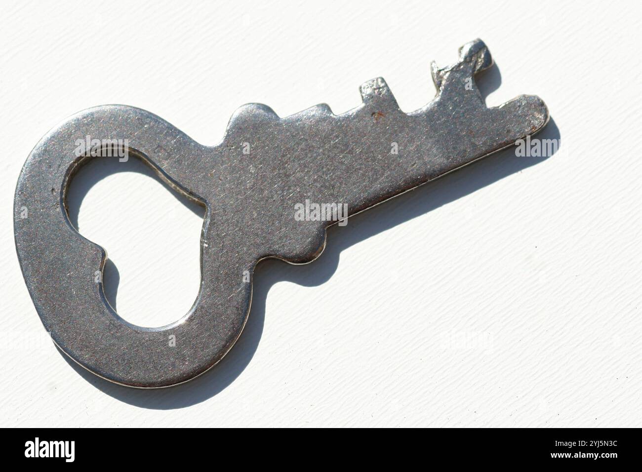 Antique key on a white background photographed in the studio ...