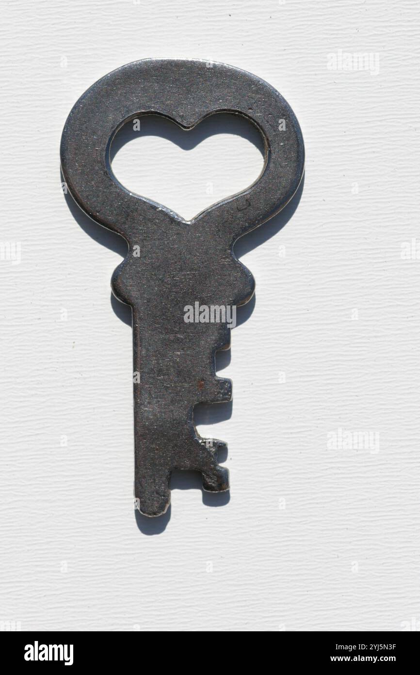 Antique key on a white background photographed in the studio ...