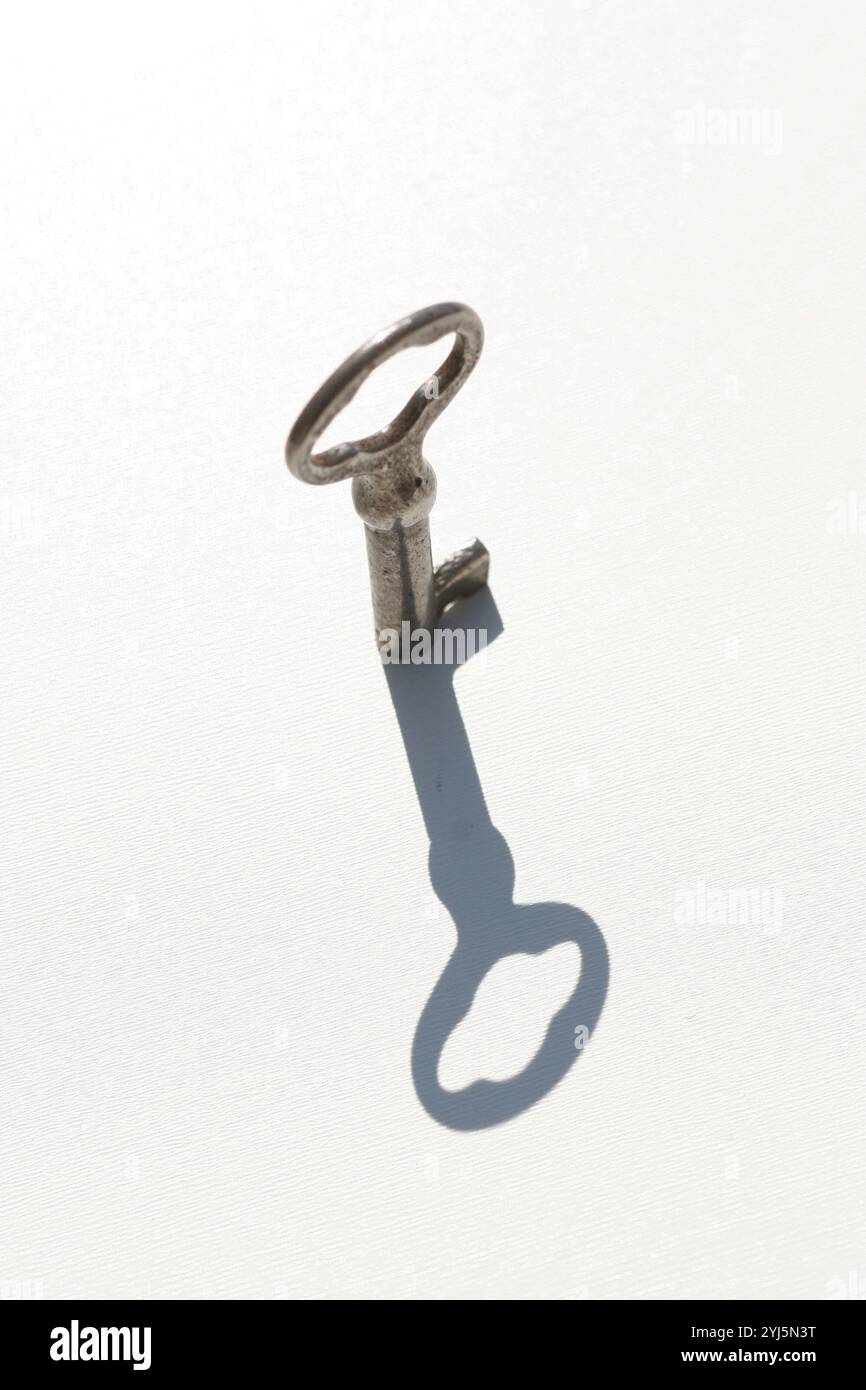 Antique key on a white background photographed in the studio ...