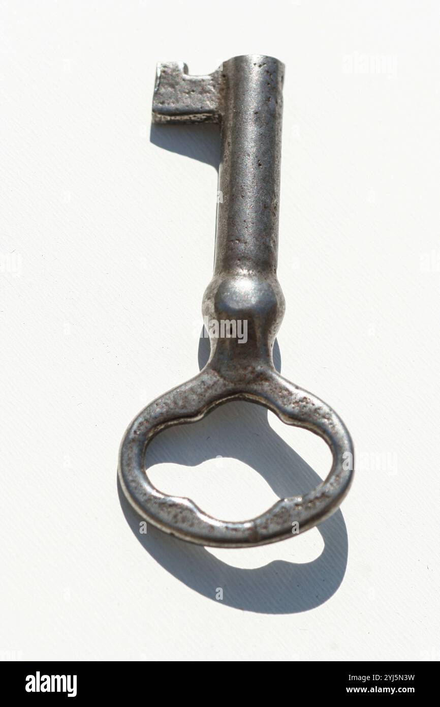 Antique key on a white background photographed in the studio ...