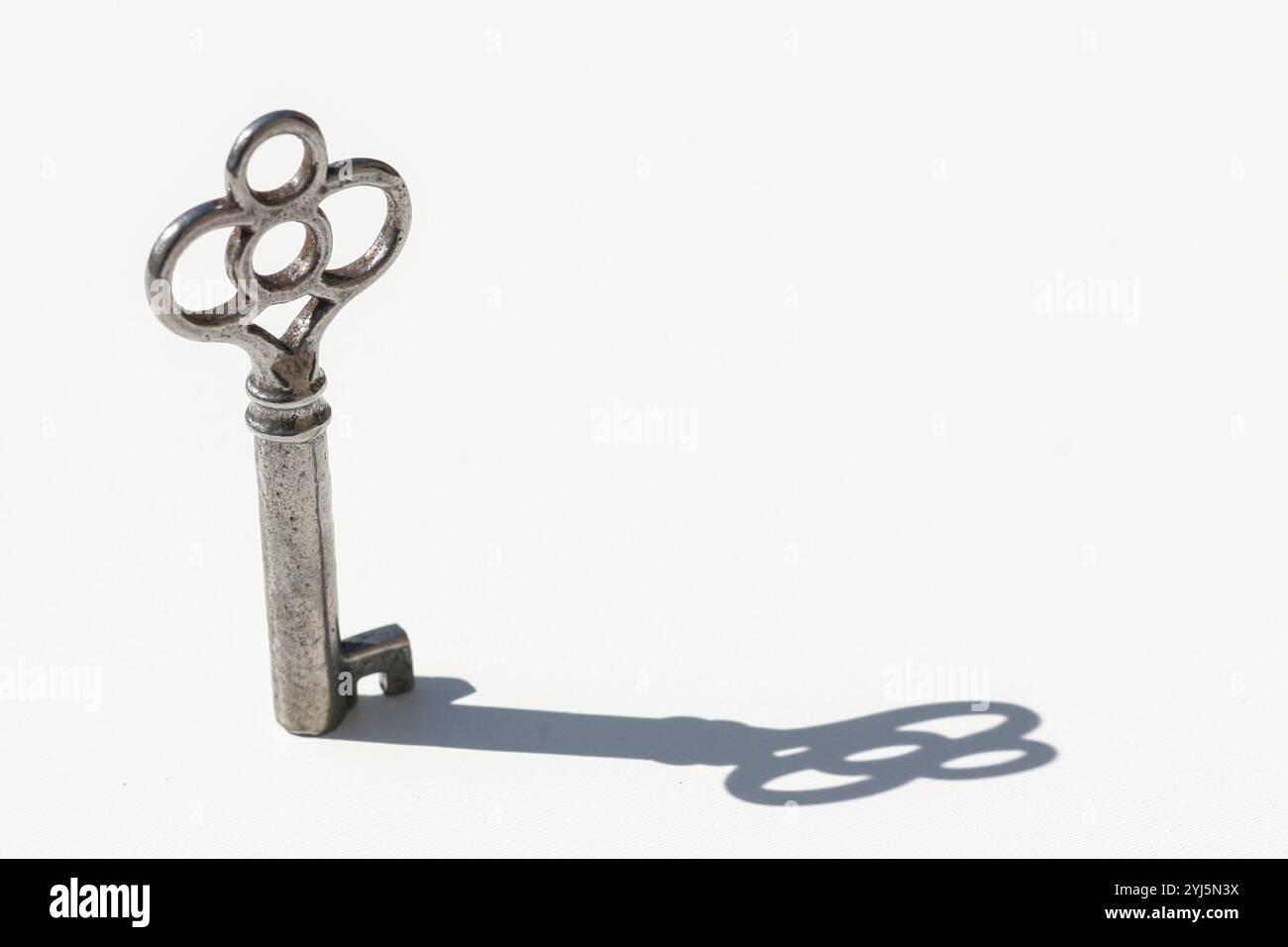 Antique key on a white background photographed in the studio ...