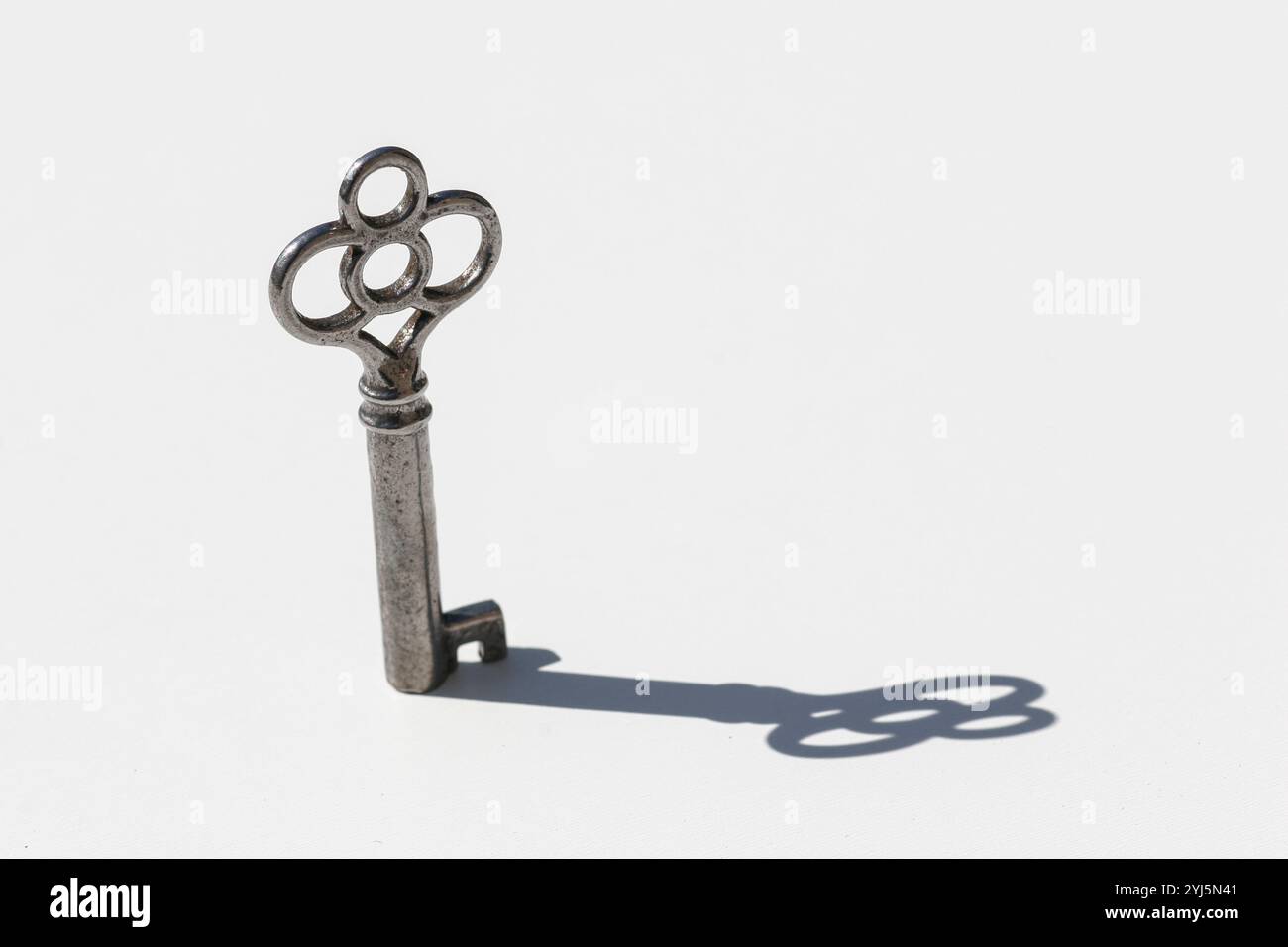 Antique key on a white background photographed in the studio ...