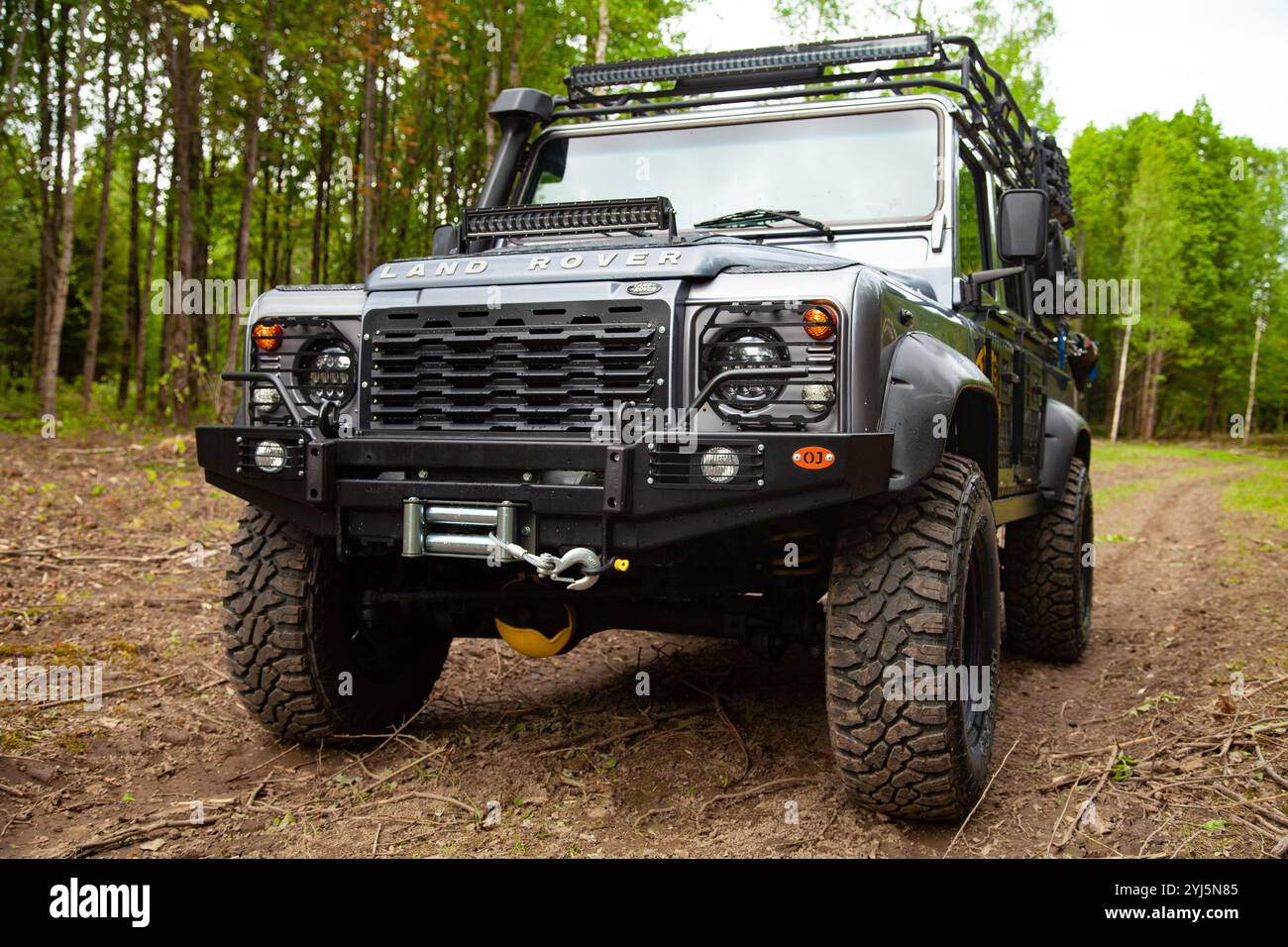 Equipped Land Rover Defender is ready for aff road in the forest with ...