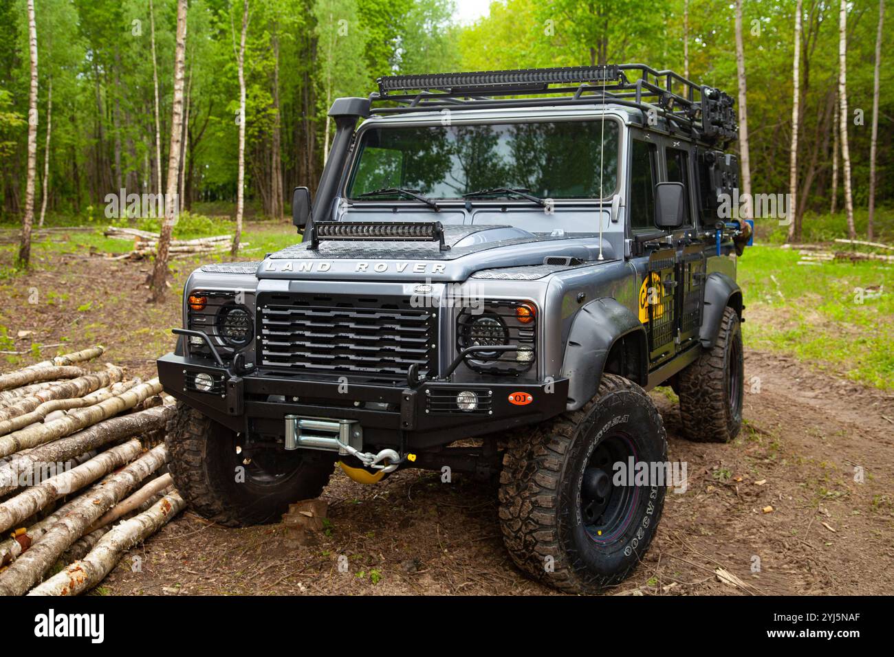 Equipped Land Rover Defender is ready for aff road in the forest with ...