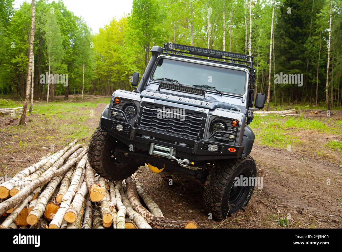 Equipped Land Rover Defender in the forest with all necessary equipment ...