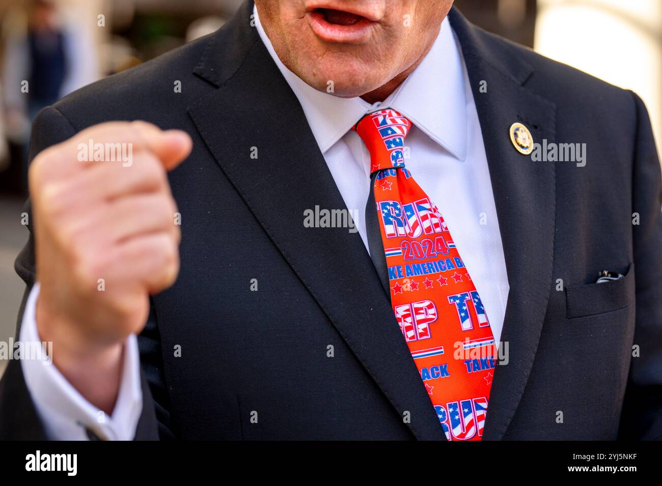 Rep. Troy Nehls, R-Texas, wears a Trump themed tie as he speaks with a ...