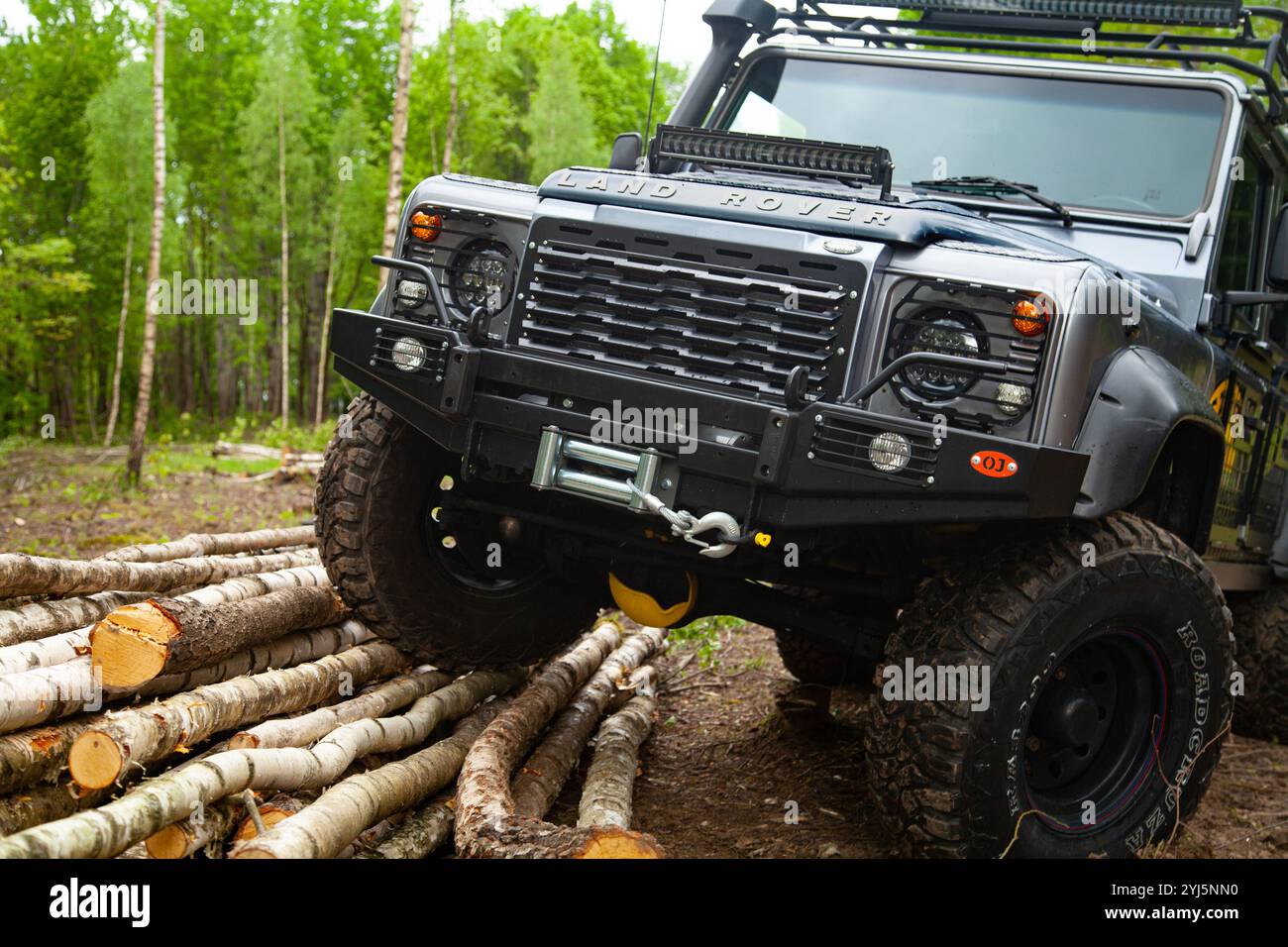 Equipped Land Rover Defender in the forest with all necessary equipment ...