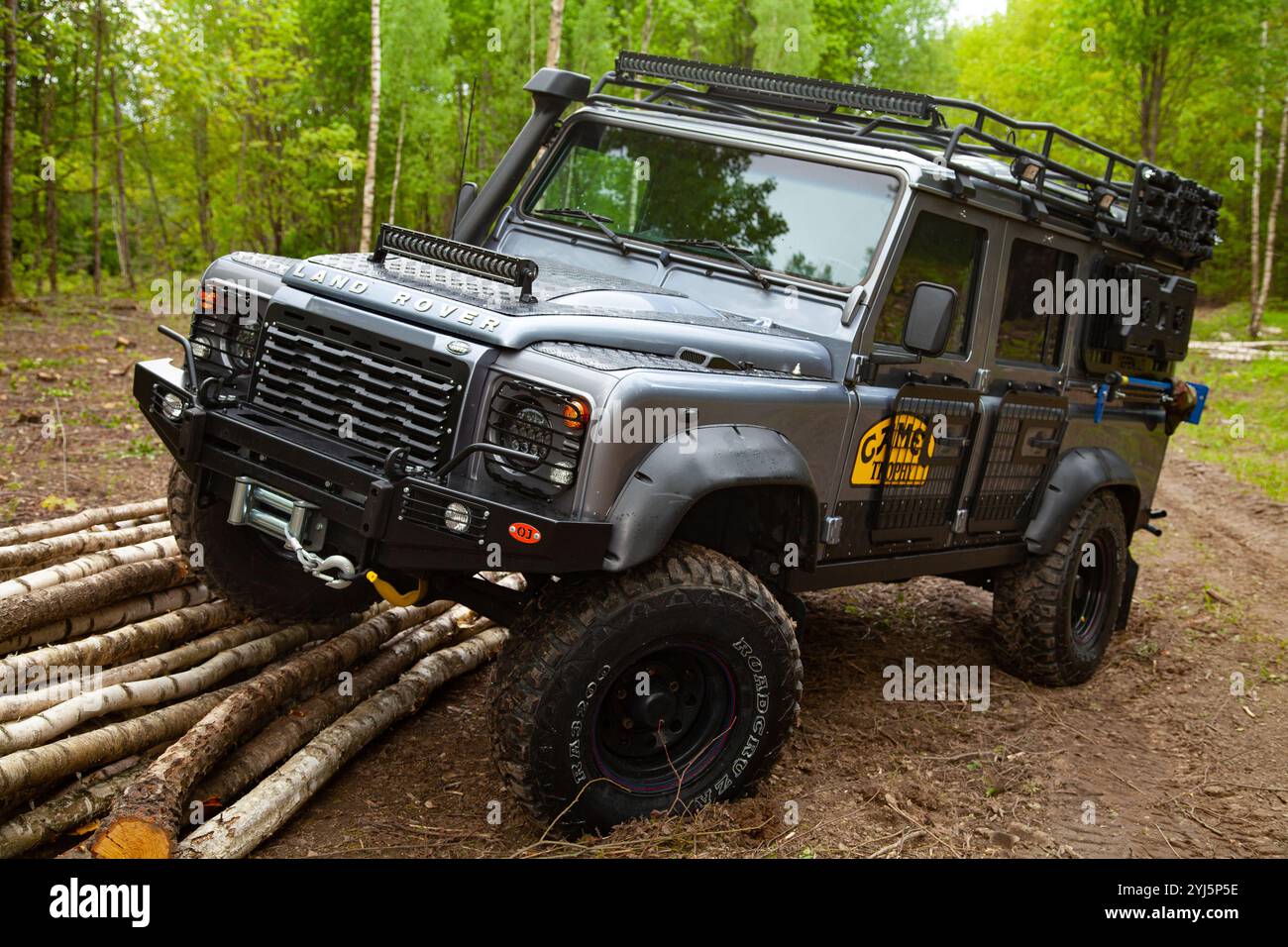 Equipped Land Rover Defender in the forest with all necessary equipment ...