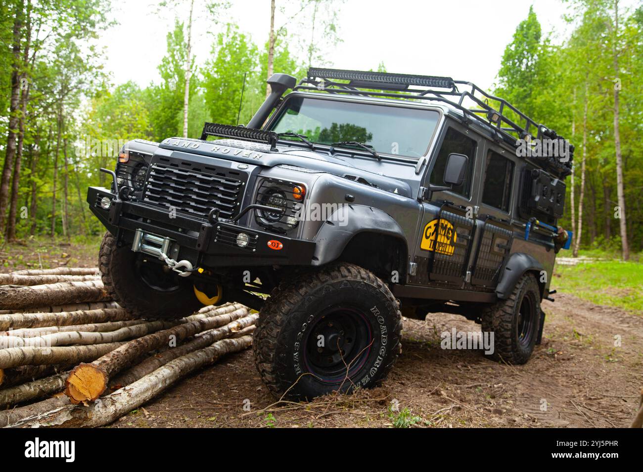 Equipped Land Rover Defender in the forest, ready for off road, shows ...