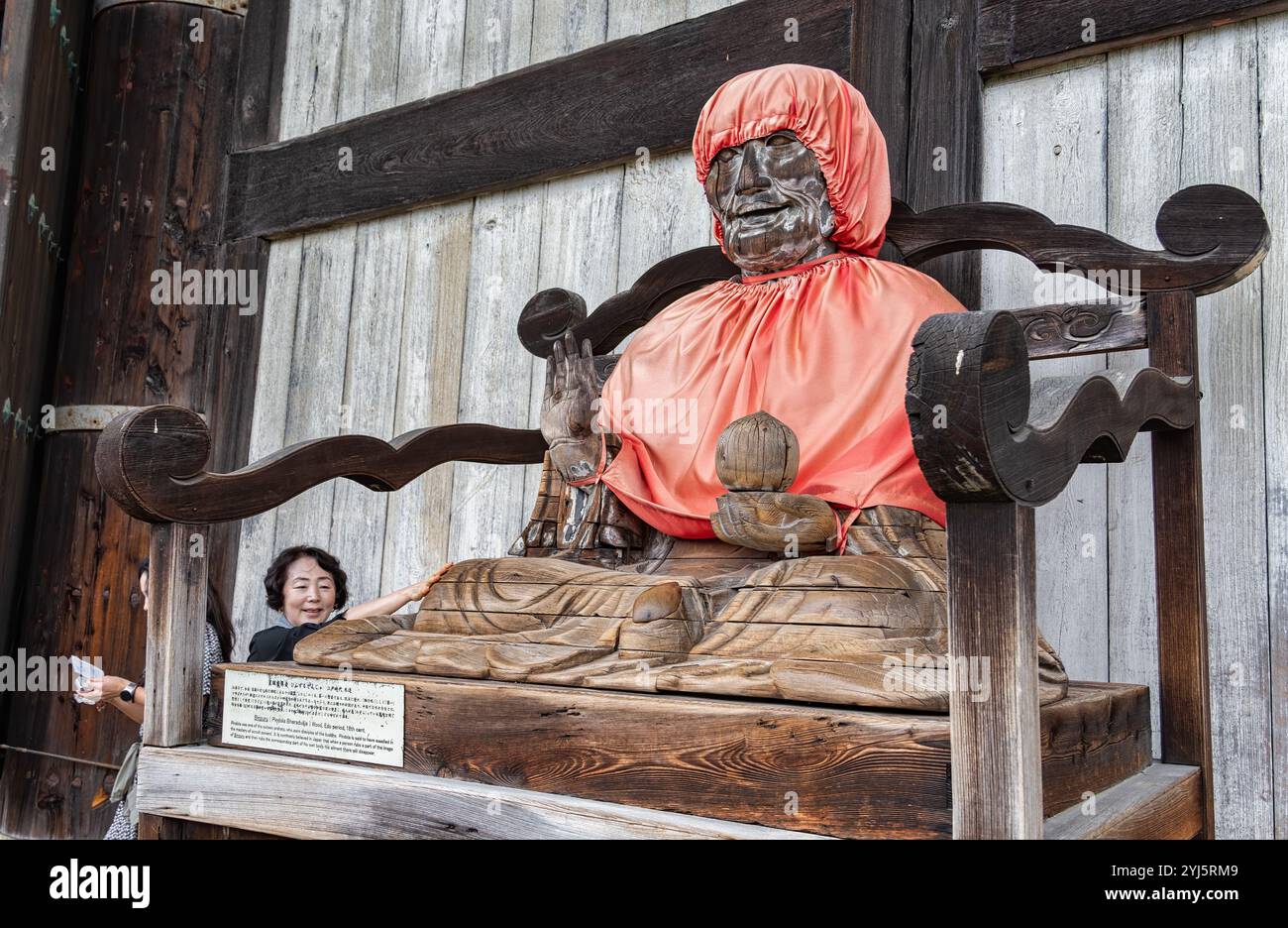The wooden statue of Binzuru (Pindola Bharadvaja) at the entrance of ...