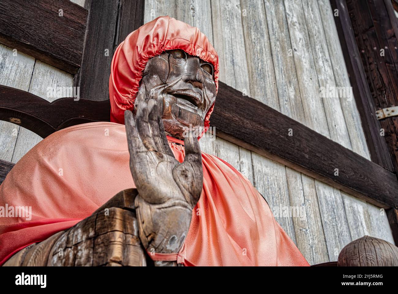 The wooden statue of Binzuru (Pindola Bharadvaja) at the entrance of ...