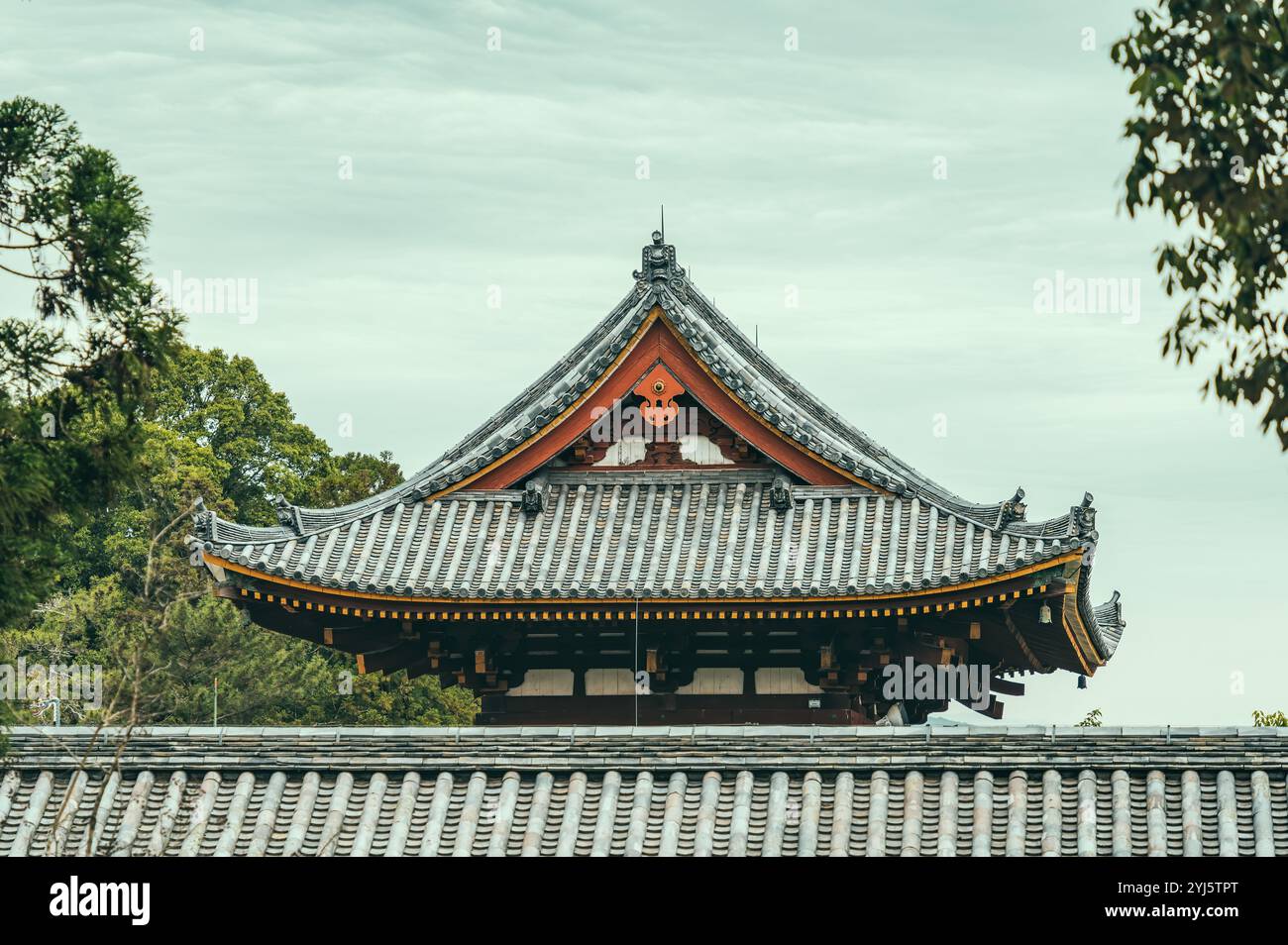 Architectural detail with the rooftop of a buddhist temple in Nara ...