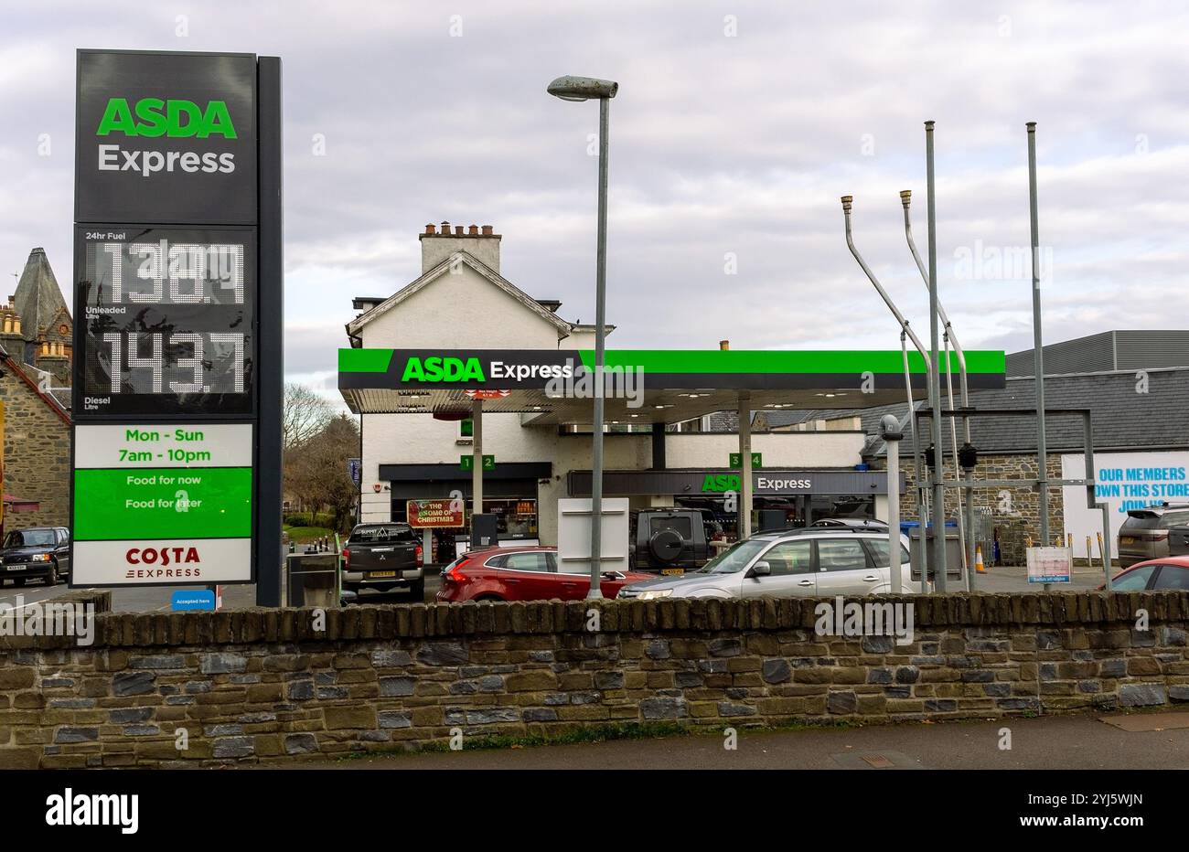 Customers filling up at Asda petrol station and shopping in the Express Shop, Aberfeldy ...