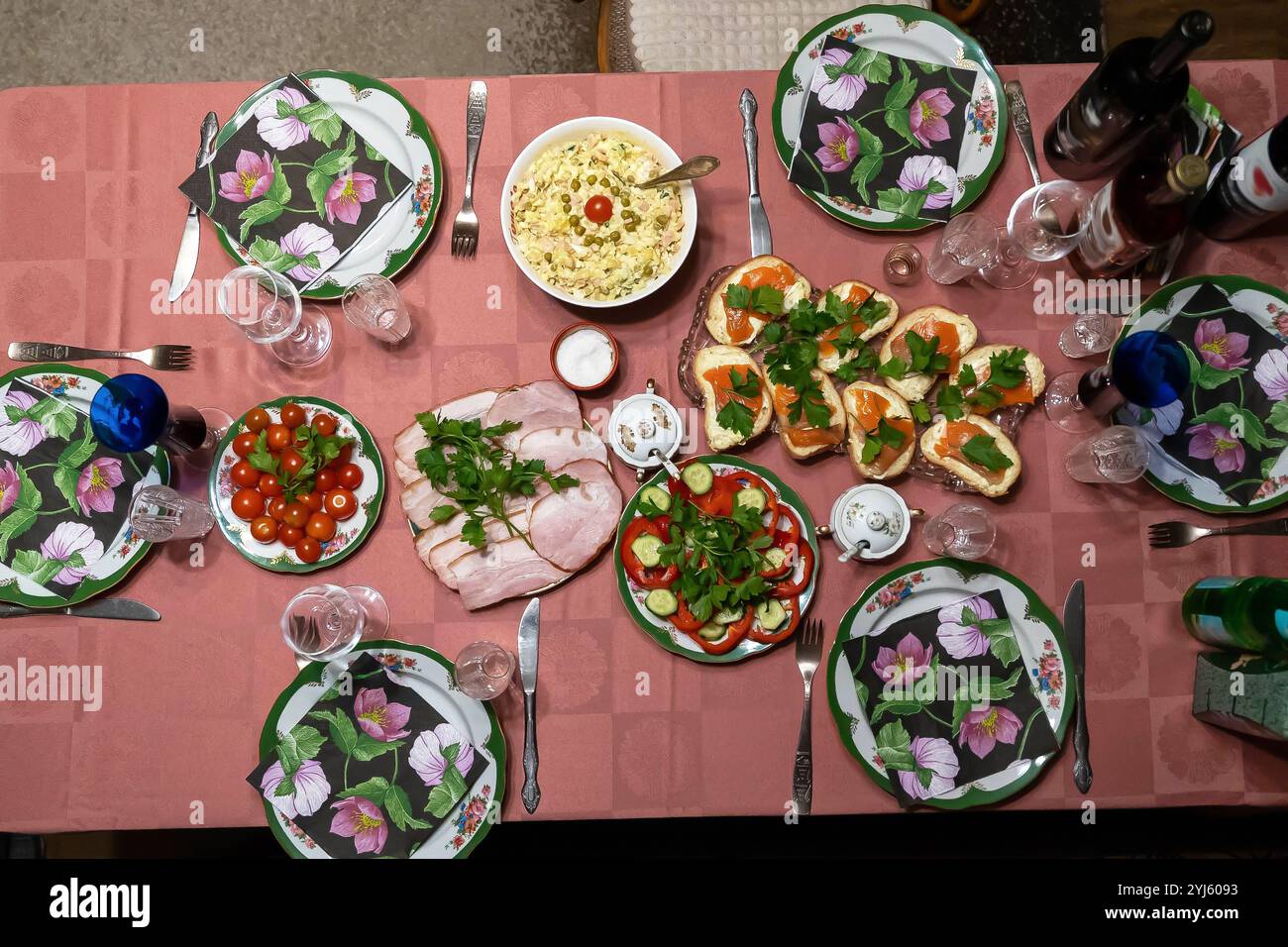 Plates of delicious food and elegant place settings create a welcoming ...