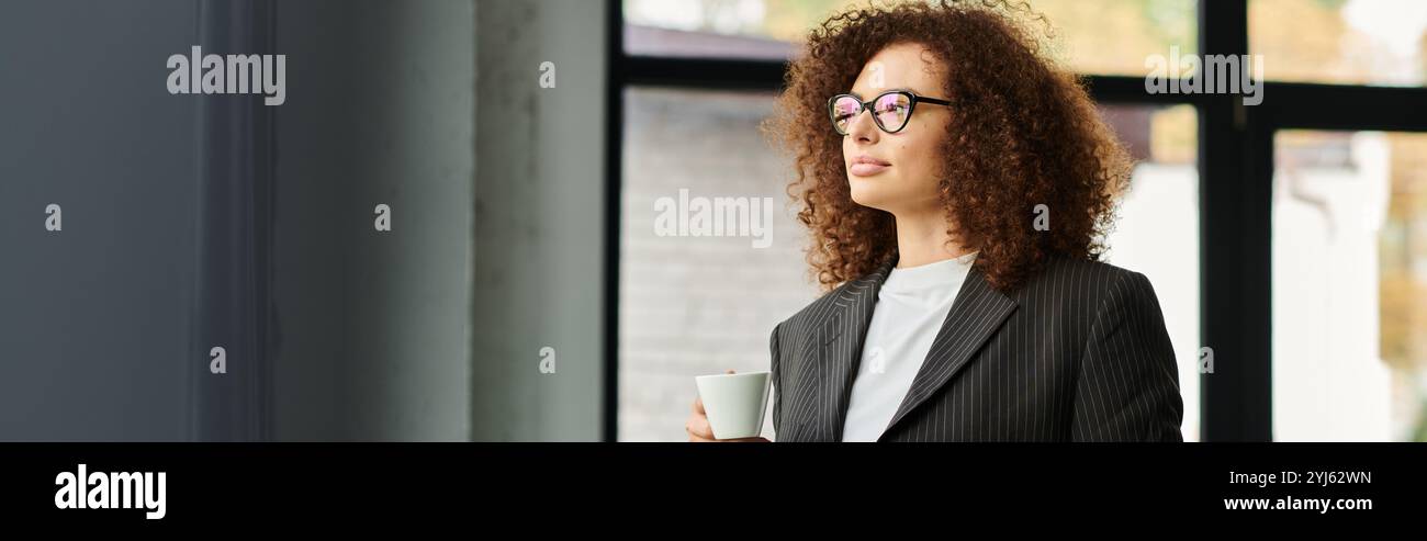 The woman sips coffee thoughtfully, basking in the light of an ...