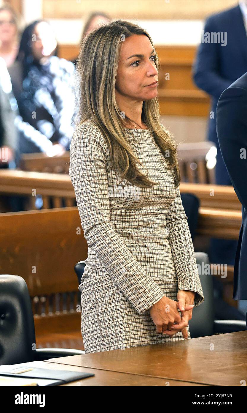 Karen Read stands as Judge Beverly Cannone enters the court during her ...