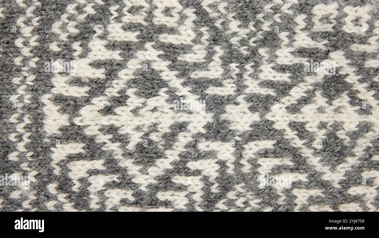 Above view of gray and white traditional knitted pattern. Background ...