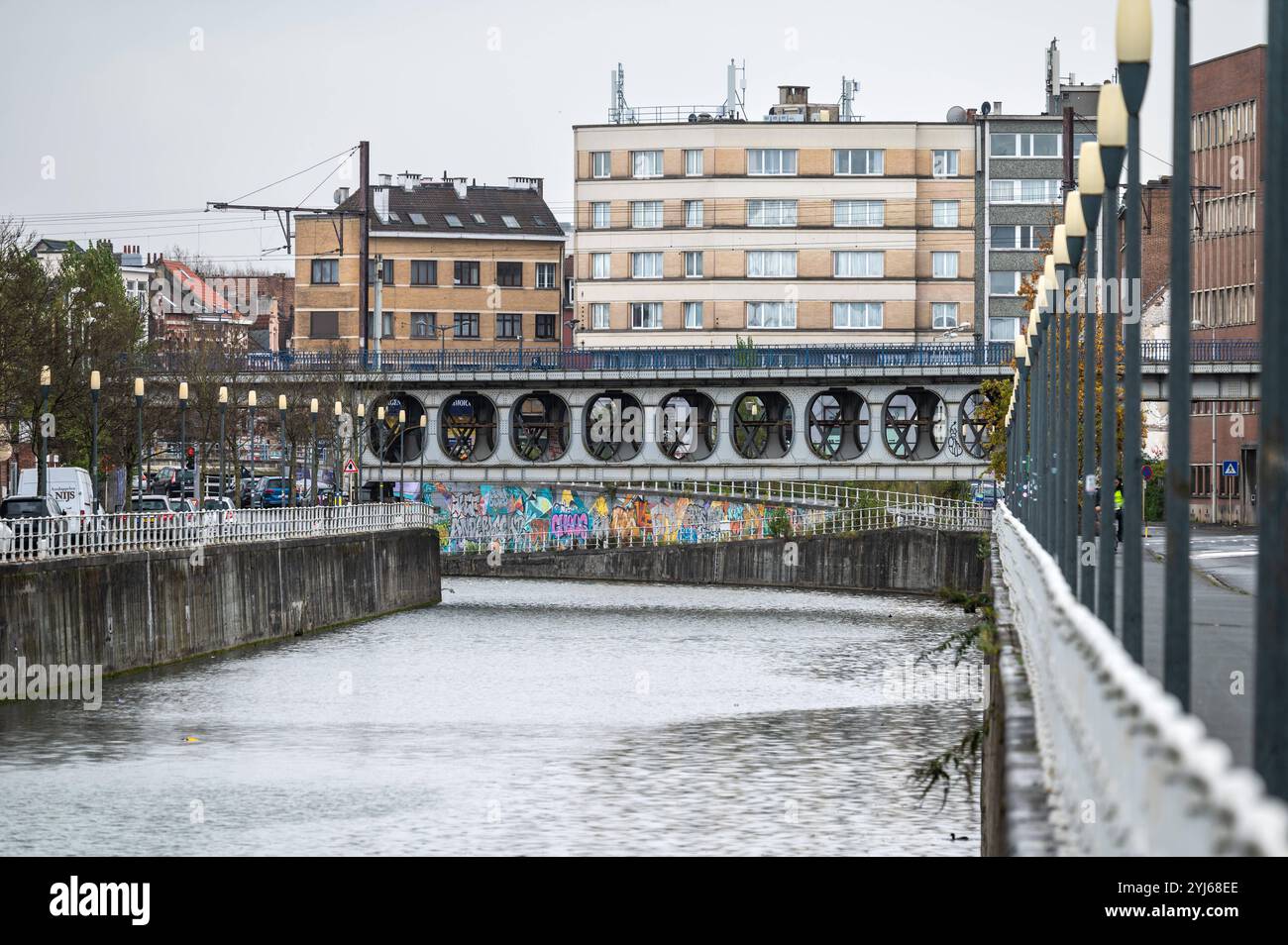 The canal banks with residential apartments and metal Vierendeel ...