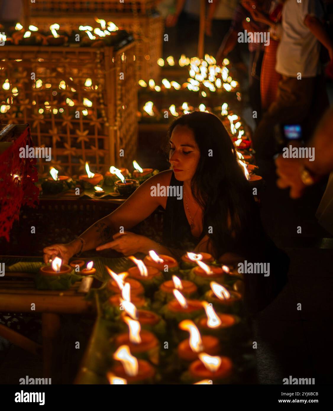A visitor seen lighting a phang pateet lantern during the Tam Phang ...