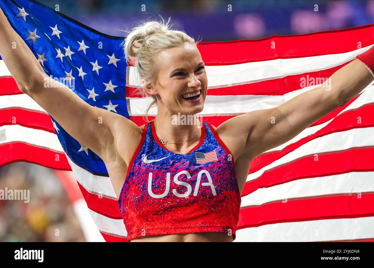 Katie Moon celebrating her victory with her country's flag at the Paris ...
