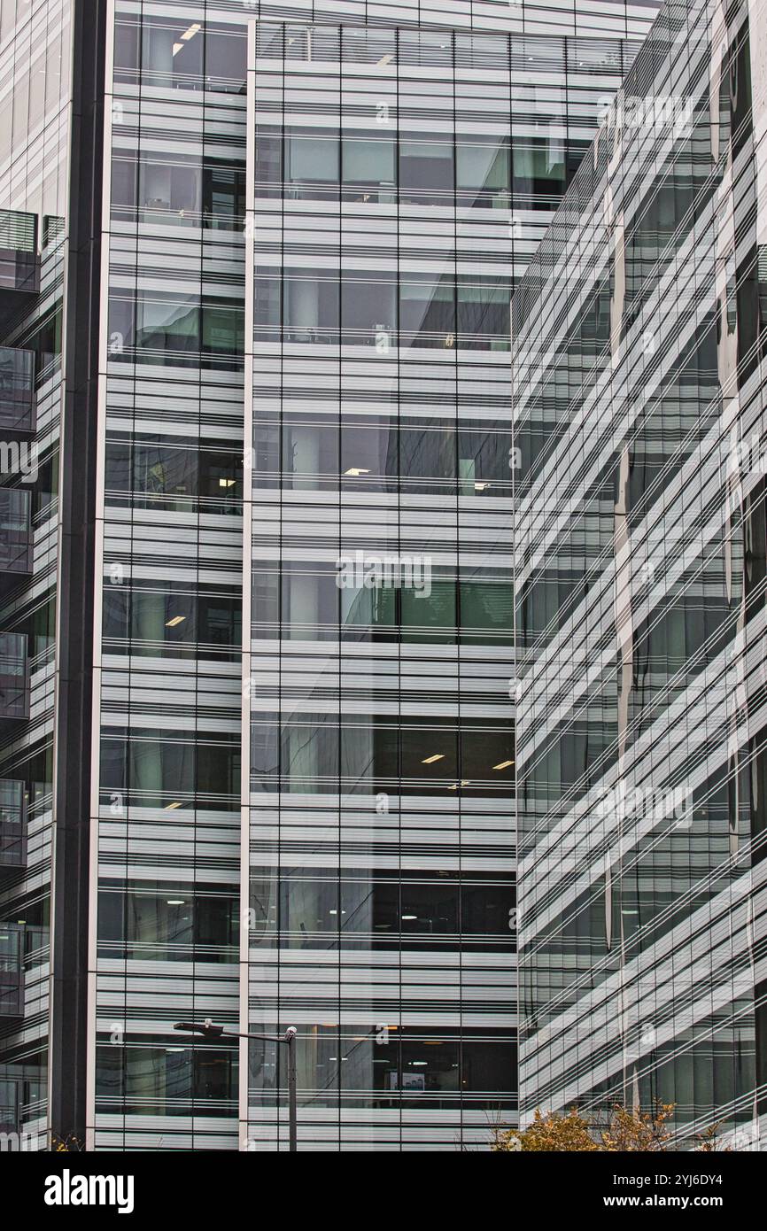 A close-up view of a modern office building featuring a grid-like ...