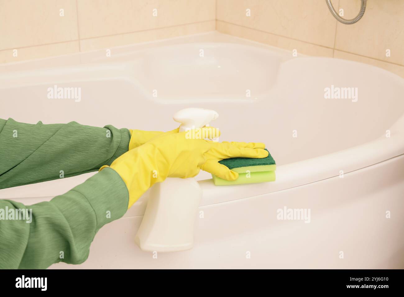 Hands Women Wearing Protect Glove Yellow using liquid Cleaning solution ...
